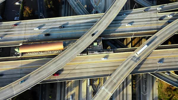 Bustling, fast moving cars on multi-layered bridges on sunny day in Los ...