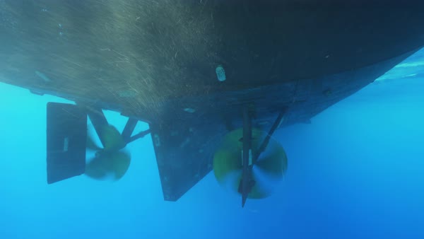 Underwater shot of big boat propeller spinning as they move across the ...