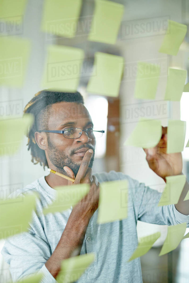 Employee reading reminders on notepapers - Royalty-free Stock Photo ...