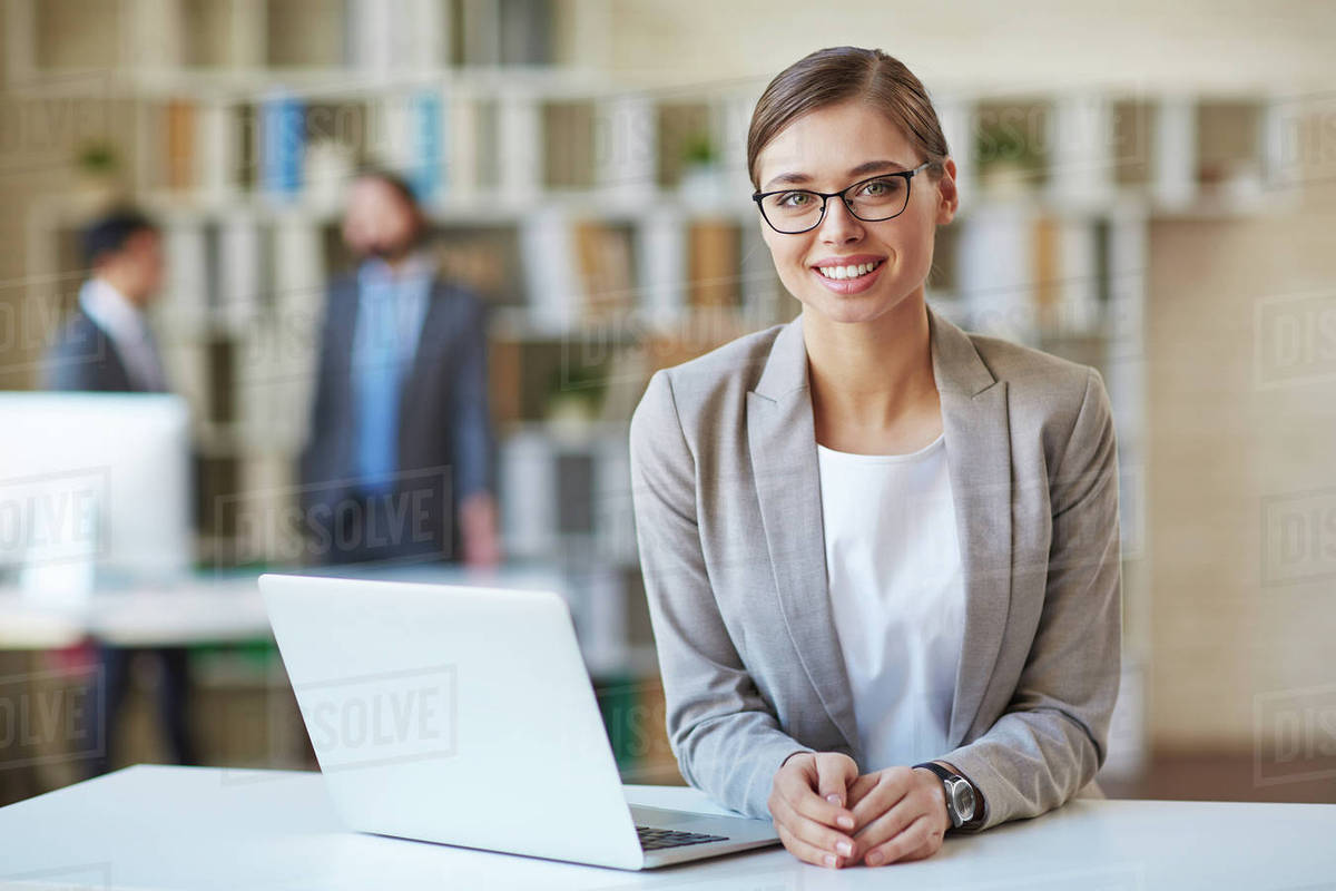 Happy young employee looking at camera - Royalty-free Stock Photo ...