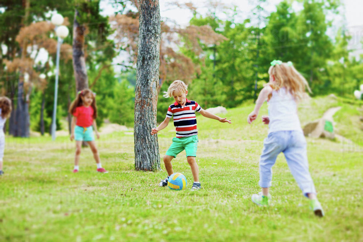 Little friends playing with ball in natural environment - Royalty-free ...