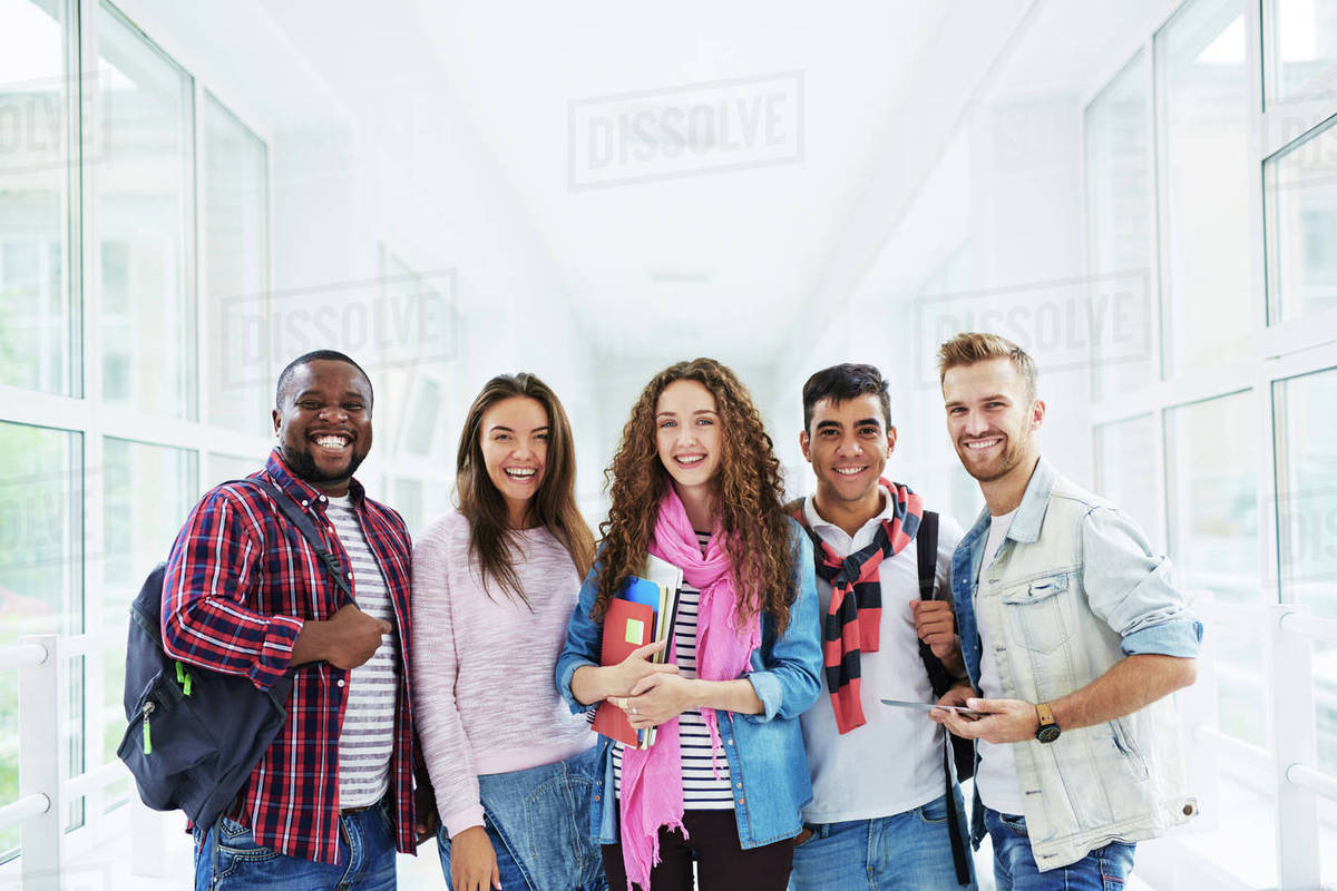Cheerful students looking a camera with smiles - Stock Photo - Dissolve