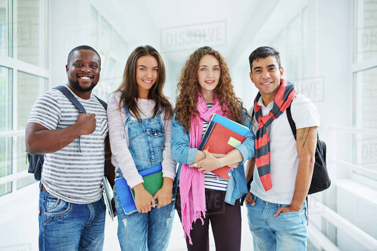 Friendly students looking at camera in college - Royalty-free Stock ...