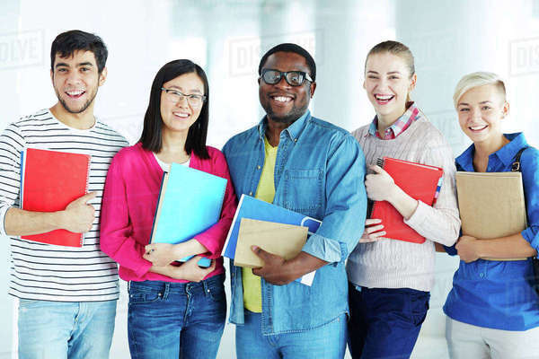 Happy students with books standing in row - Royalty-free Stock Photo ...