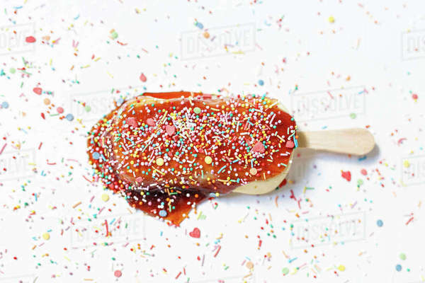 Close-up of choc-ice with sprinkles - Royalty-free Stock Photo | Dissolve