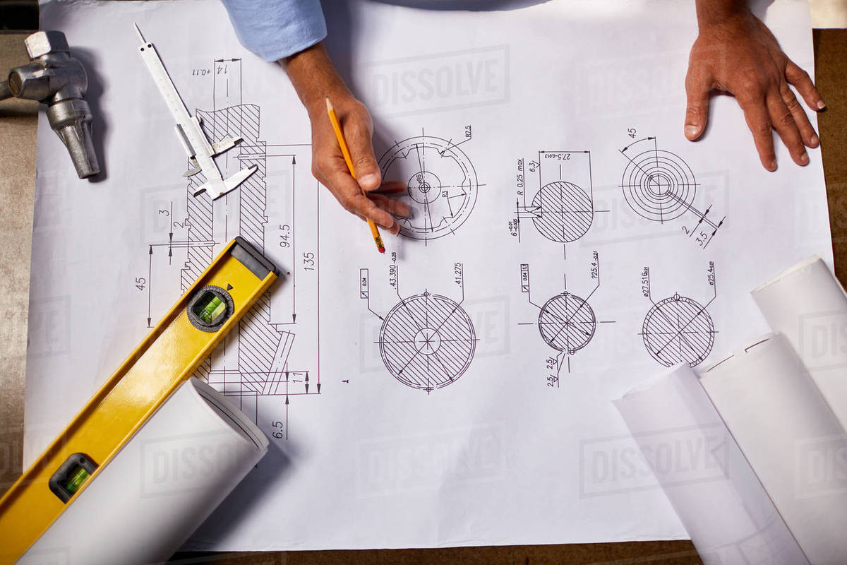 Hands of engineer over sketch of machine part - Royalty-free Stock ...