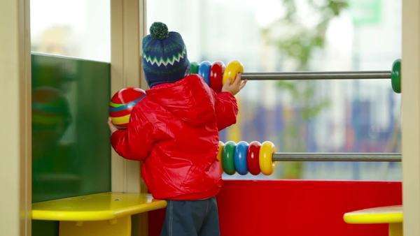 Little boy with a toy counting the playground abacus - Stock Video ...