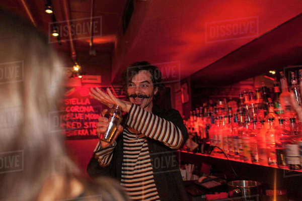 Bartender serving drinks at a nightclub - Royalty-free Stock Photo ...