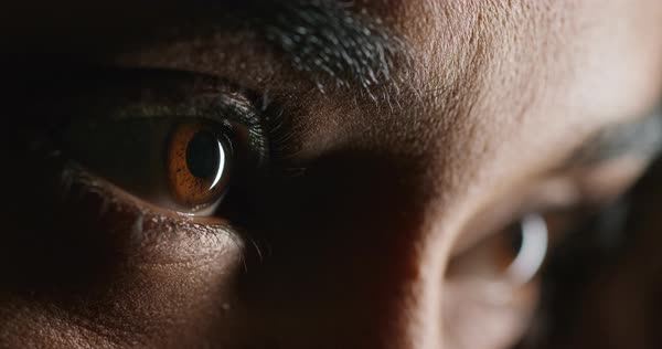Close up macro beauty brown eyes opening light revealing iris ...