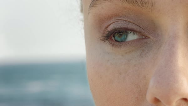 Close up beautiful eye opening in beach background healthy vision ...