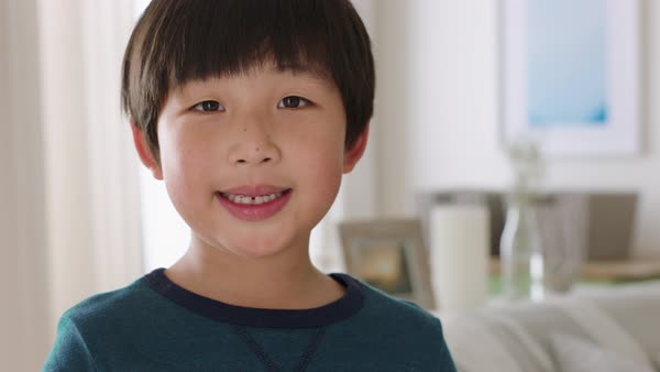 Portrait happy little asian boy sticking out tongue naughty child ...