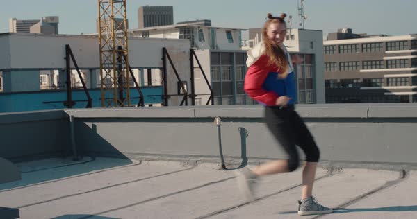 Funny woman dancing on rooftop celebrating enjoying silly dance having ...