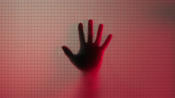 Hand sliding down window dying in red light murder concept - Stock ...