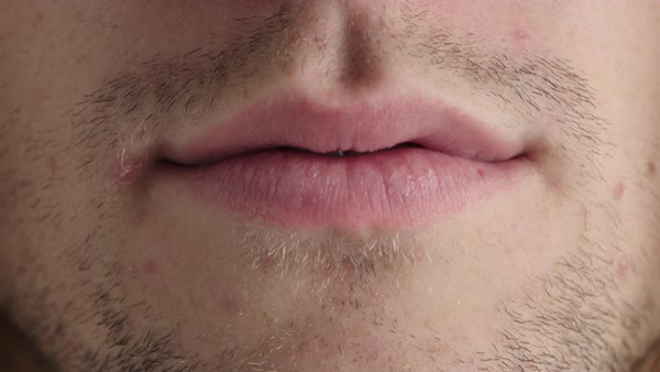 Close up young man lips caucasian male mouth unshaved facial hair skin ...