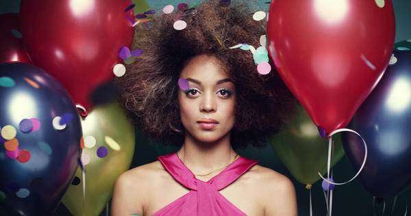 Sad single woman celebrating birthday party alone multicolored balloon ...