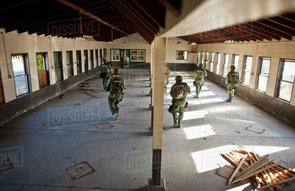 Group of police officers inside a building during an exercise at ...