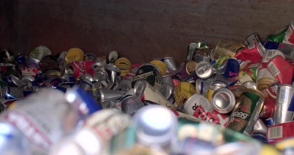Sorting garbage at a mobile waste sorting point. Close up. Aluminium ...