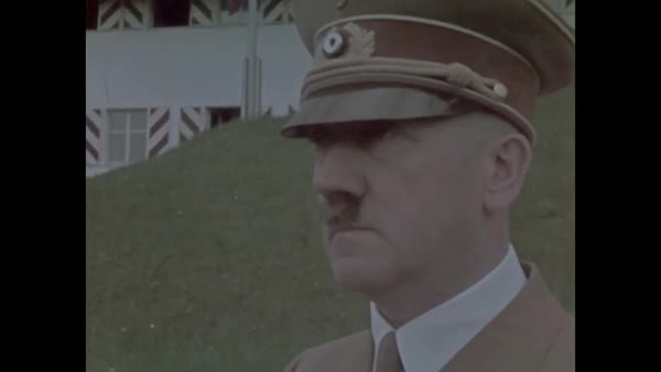 World War Two. Adolf Hitler stand in front of the Berghof. He look into ...
