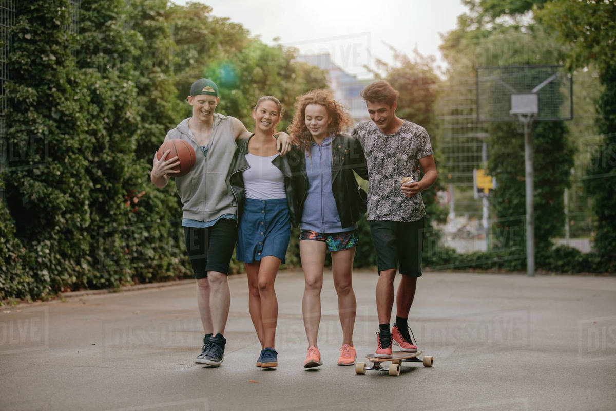 Full length shot of multiracial group of people enjoying a walk ...