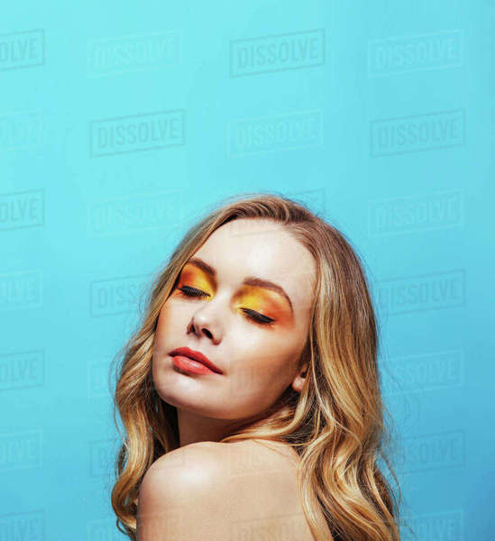 Closeup artistic portrait of beautiful young female model with ...