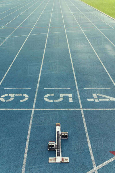 Starting block placed at the start line of a running track. Metal ...