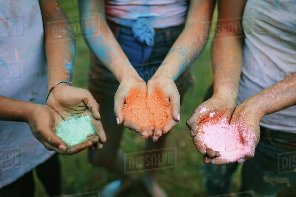 Friends playing with colored powder in a park - Royalty-free Stock ...