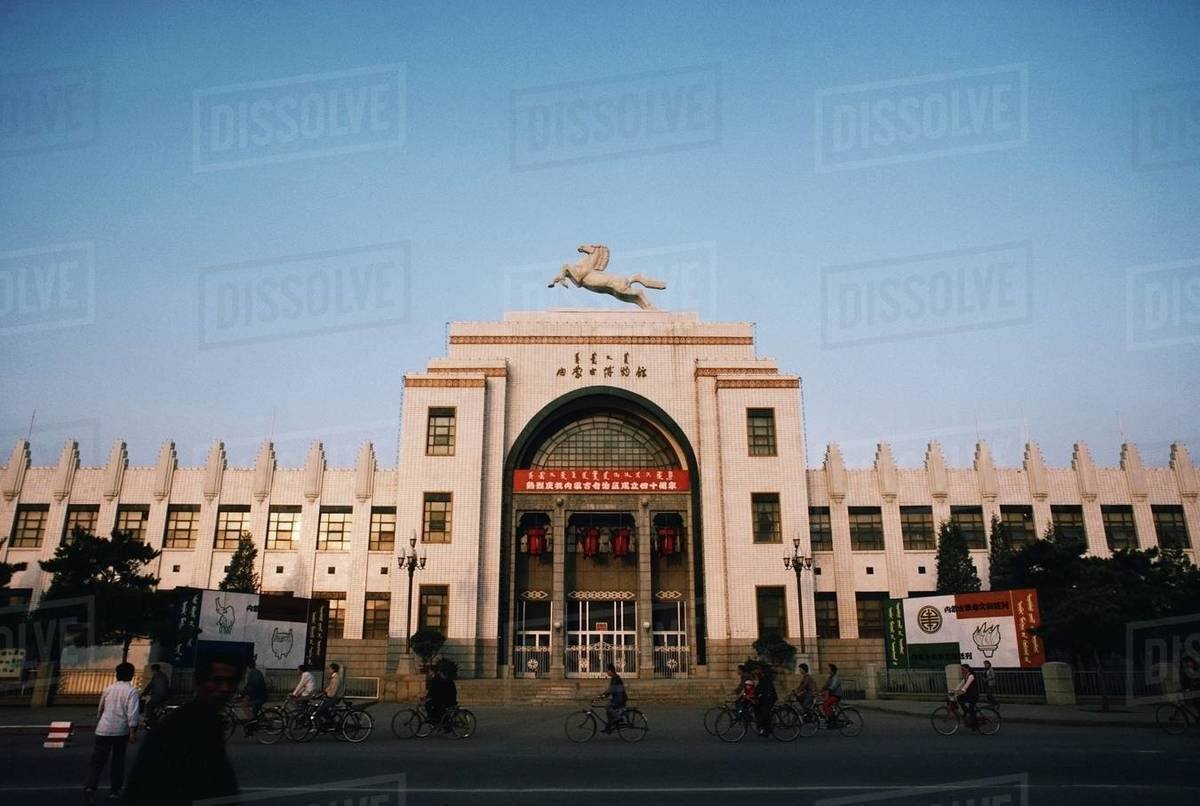 People commuting in front a museum, Inner Mongolia Museum, Hohhot ...