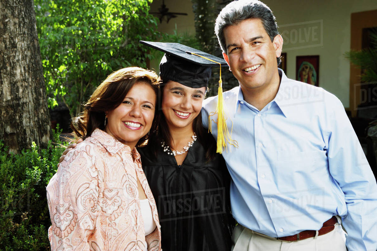 Graduate and parents smiling for the camera - Royalty-free Stock Photo ...