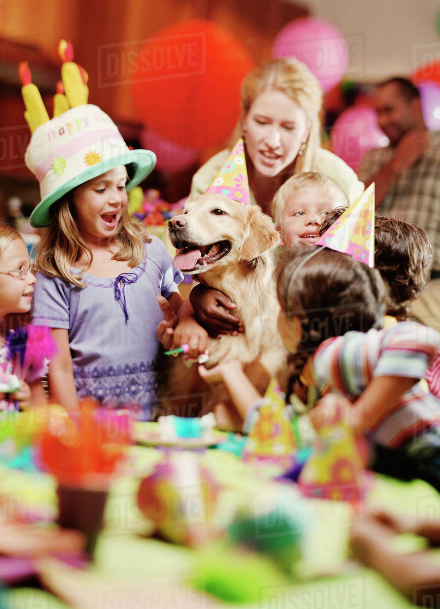 Group of children at birthday party with dog - Royalty-free Stock Photo ...
