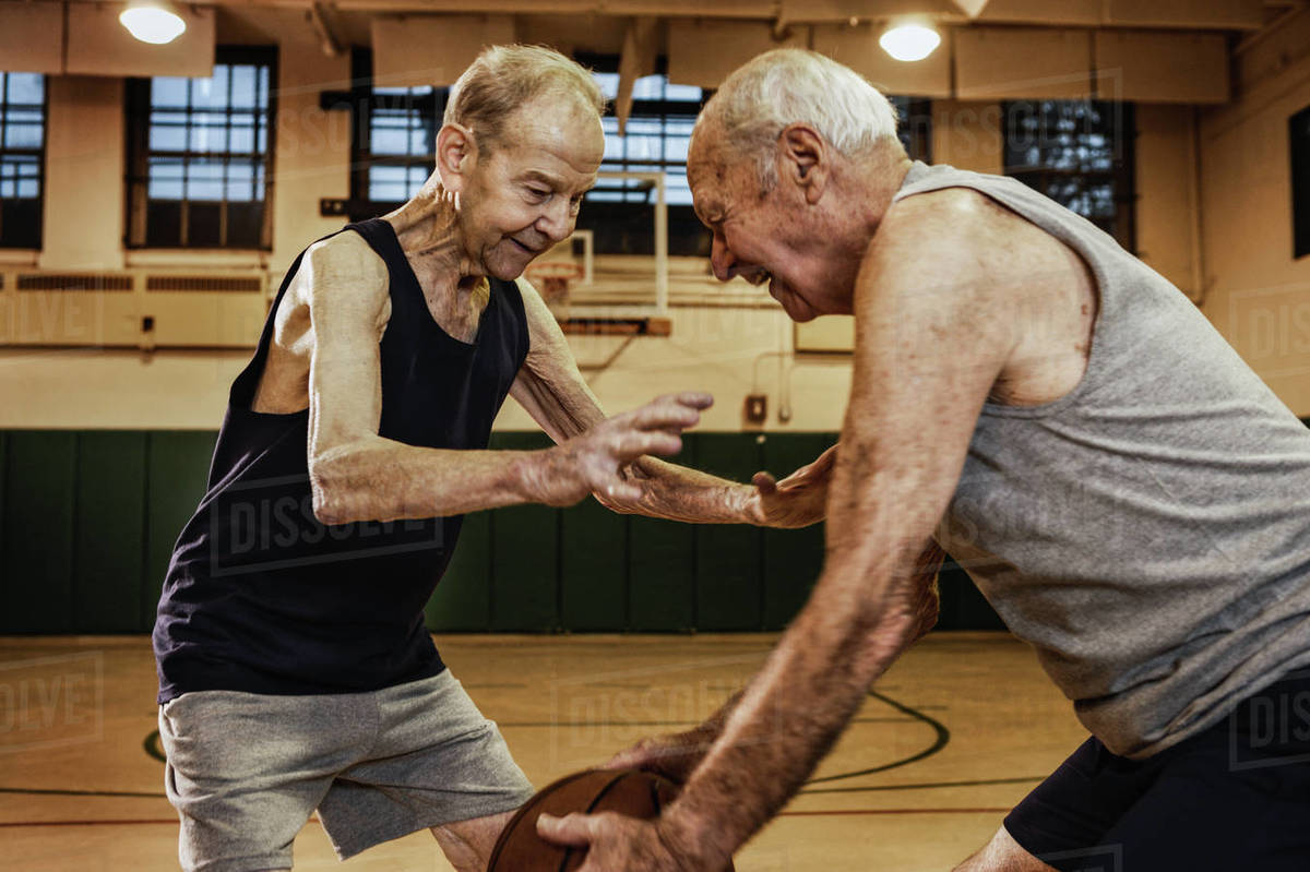 Elderly men playing basketball - Royalty-free Stock Photo | Dissolve