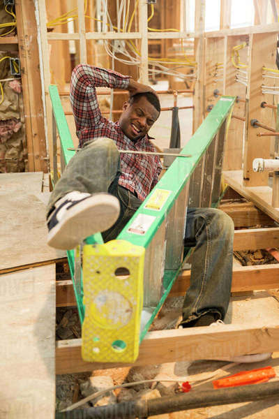 Worker falling off ladder at construction site - Royalty-free Stock ...