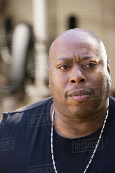 Serious Black man frowning - Royalty-free Stock Photo | Dissolve