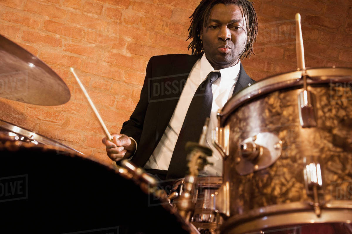 African man playing drums - Royalty-free Stock Photo | Dissolve