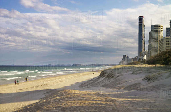 View along beach and down the coastline with Surfers Paradise high rise ...