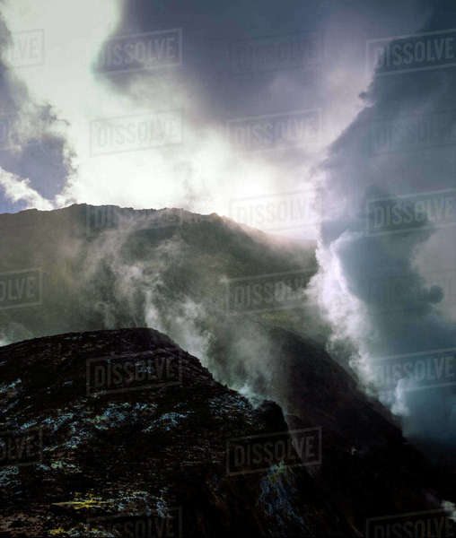 Close up of smoke raising from volcanic rocks on White Island - Royalty ...