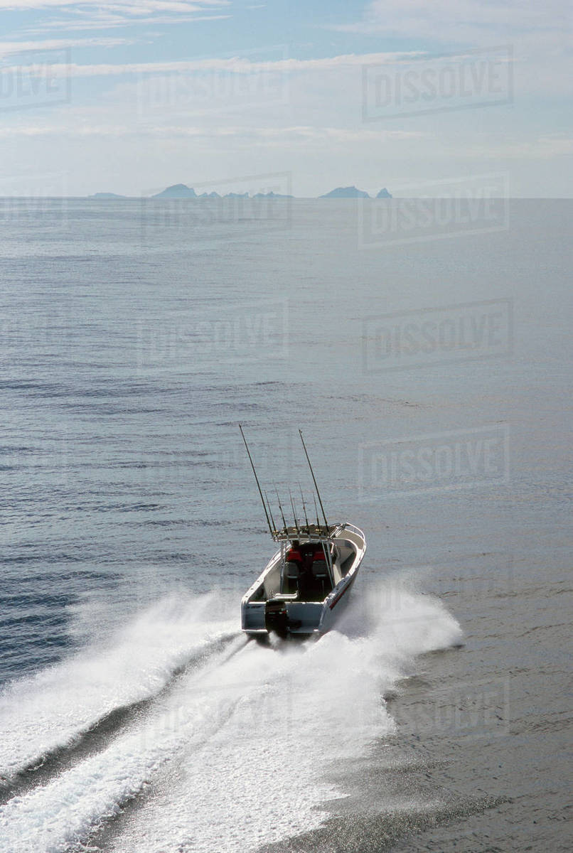 Aerial of speed boat on calm water - Royalty-free Stock Photo | Dissolve
