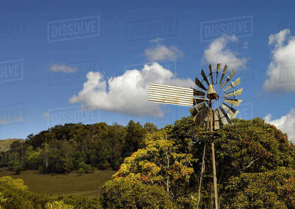 Wind driven water pump on Australian farmland - Stock Photo - Dissolve