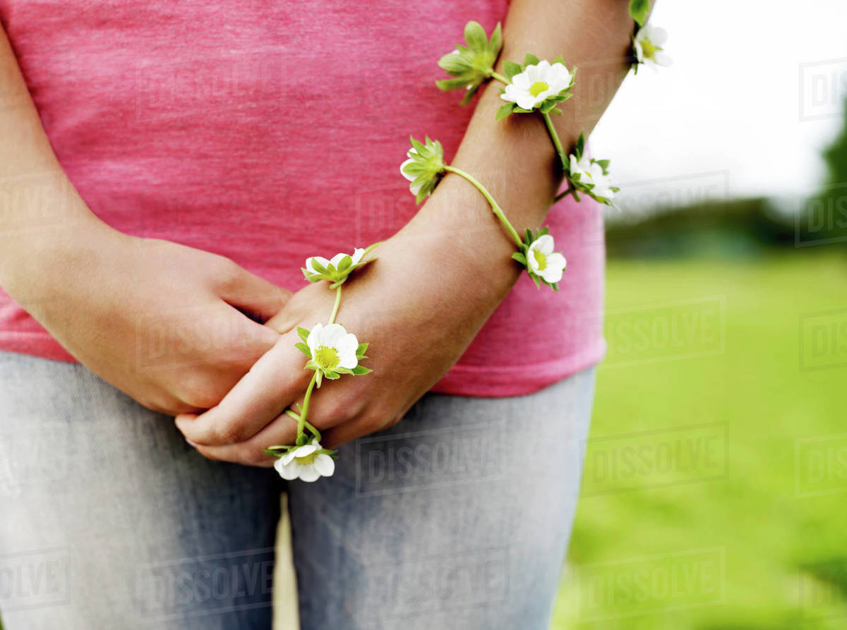 Girl standing in strawberry farm with strawberry daisy chain wrapped ...