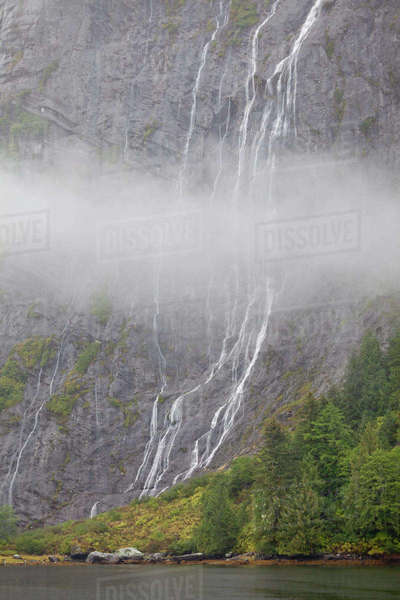 Waterfall from rocks, Fiordlands National Recreation Area, British ...