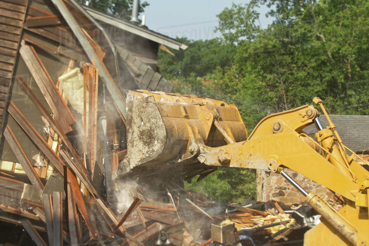 Demolition of residential home with bulldozer preparing for new ...