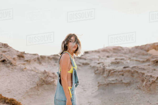 Woman in the beach wearing yellow swimsuit - Royalty-free Stock Photo ...