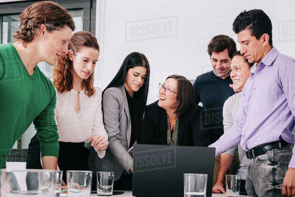 Group of office workers at a meeting around the boss - Royalty-free ...
