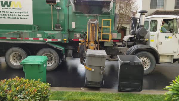 Garbage truck from the waste processing company Waste Management uses ...