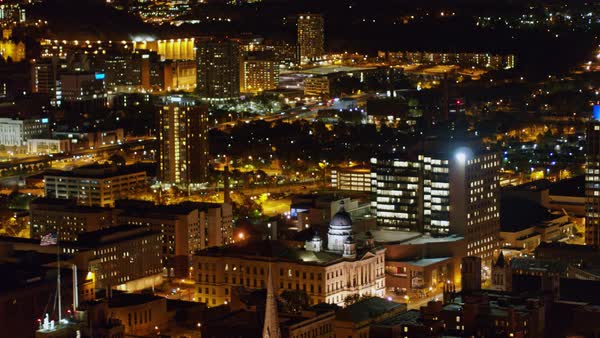Syracuse New York Aerial - Panning downtown cityscape view at night ...