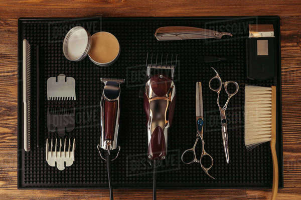 Top view of set of various professional barber tools in hair salon ...