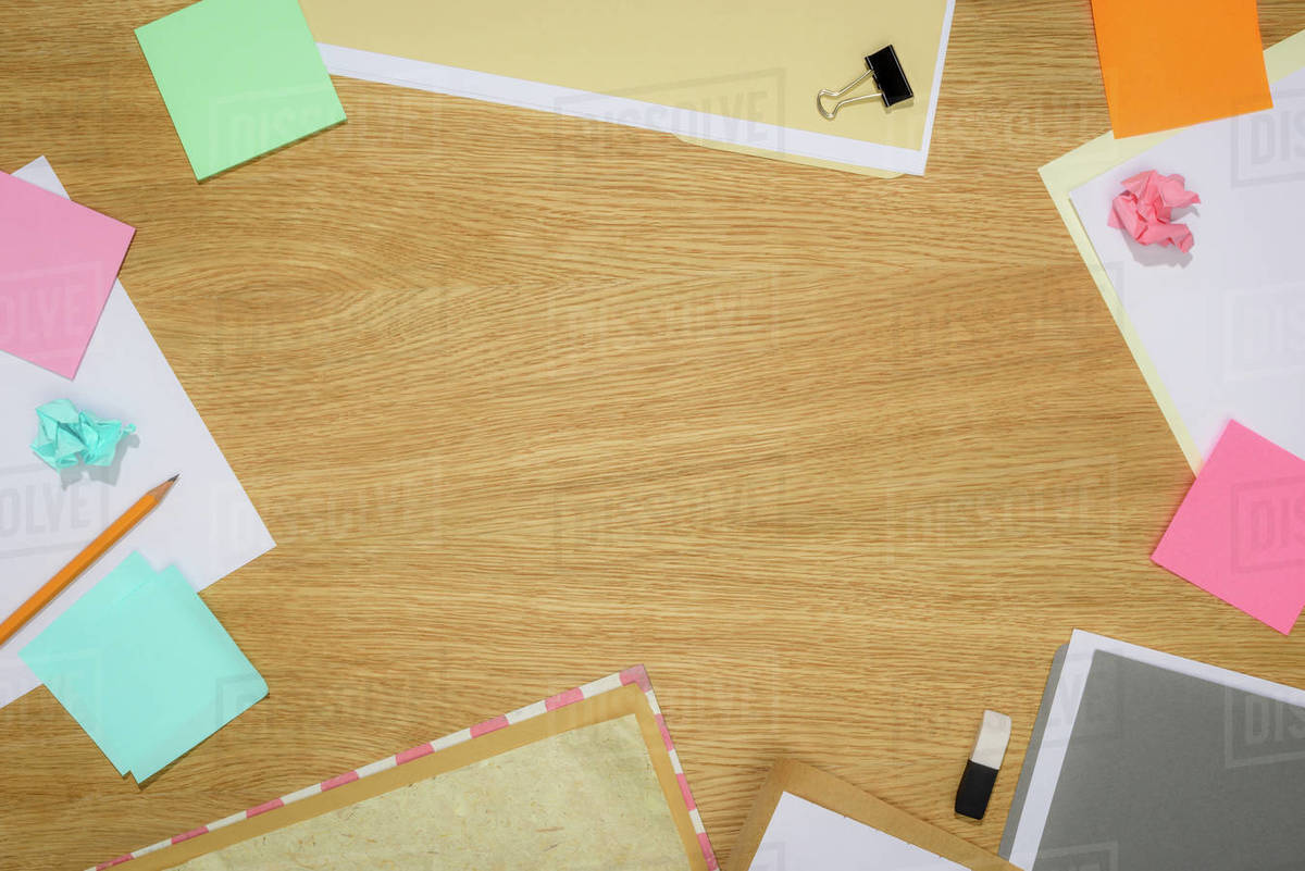Top view of table with blank papers and stick it notes with stationery ...
