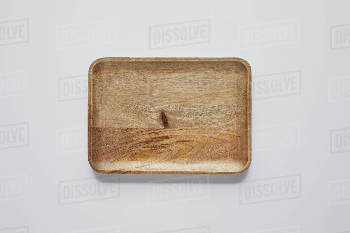 Top view of wooden tray on white table, minimalistic concept - Royalty ...