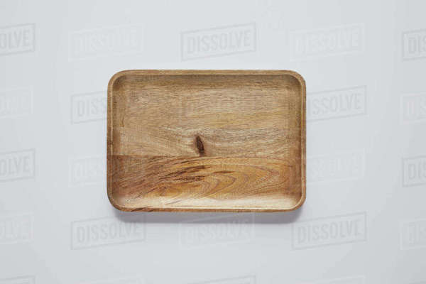 Top view of wooden tray on white table, minimalistic concept - Royalty ...