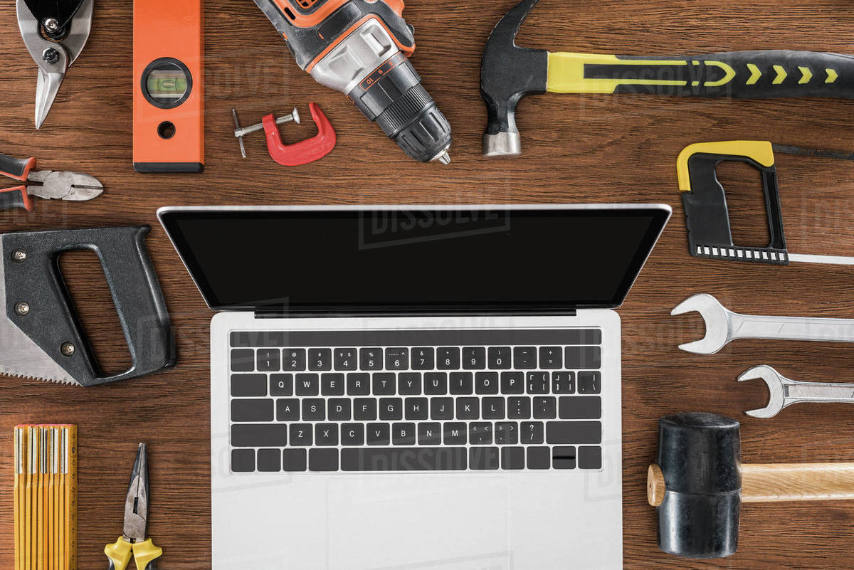 Top view of workplace with laptop with blank screen surrounded by ...