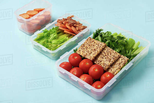 close up view of arrangement of food containers full of fresh healthy ...